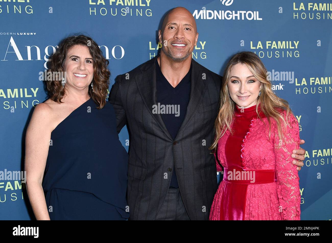 Stephanie Klasky-Gamer, from left, Dwayne Johnson and Blair Rich attend ...