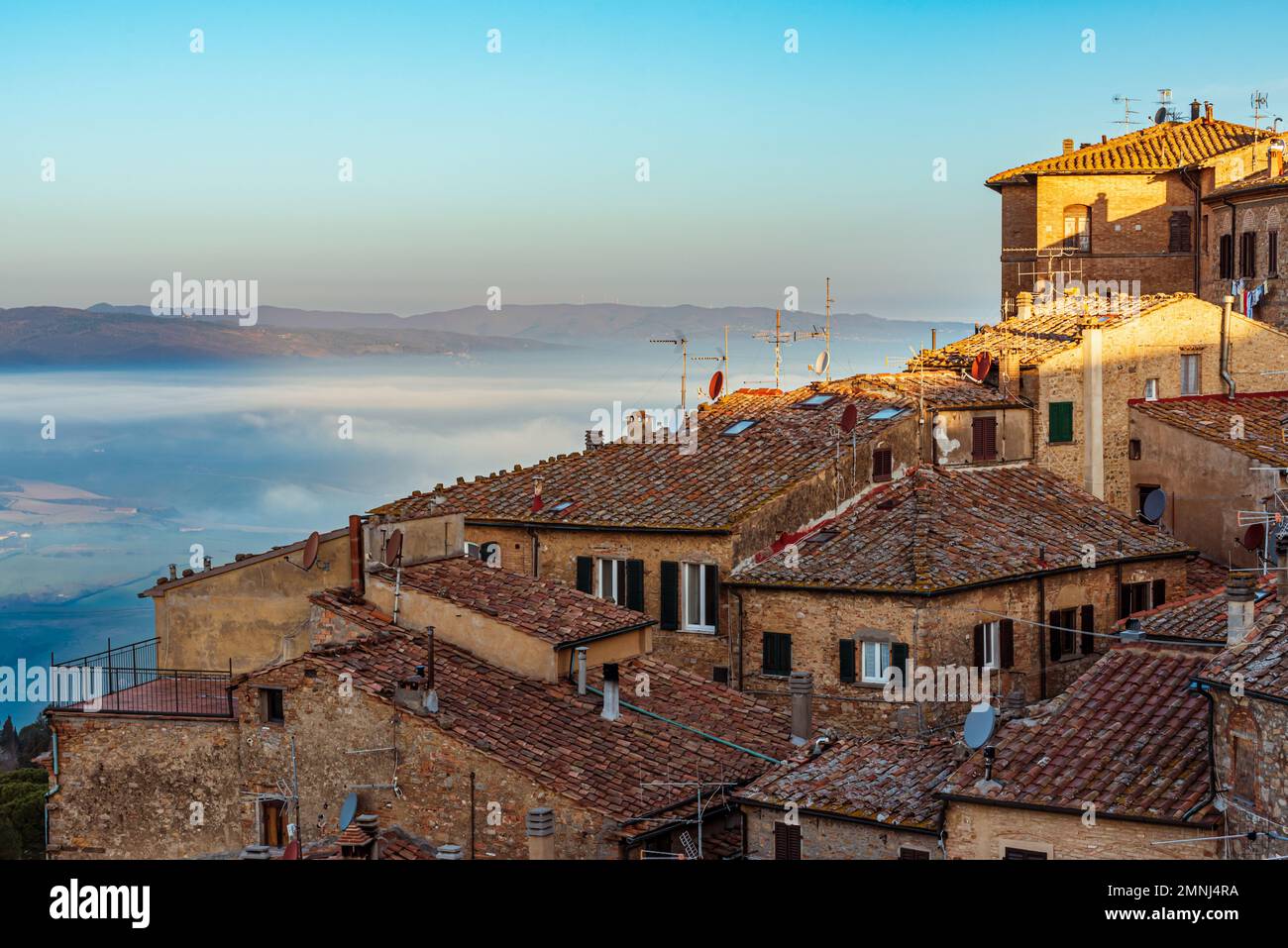 View over the tile rooftops and stone houses of the Hill Town of ...