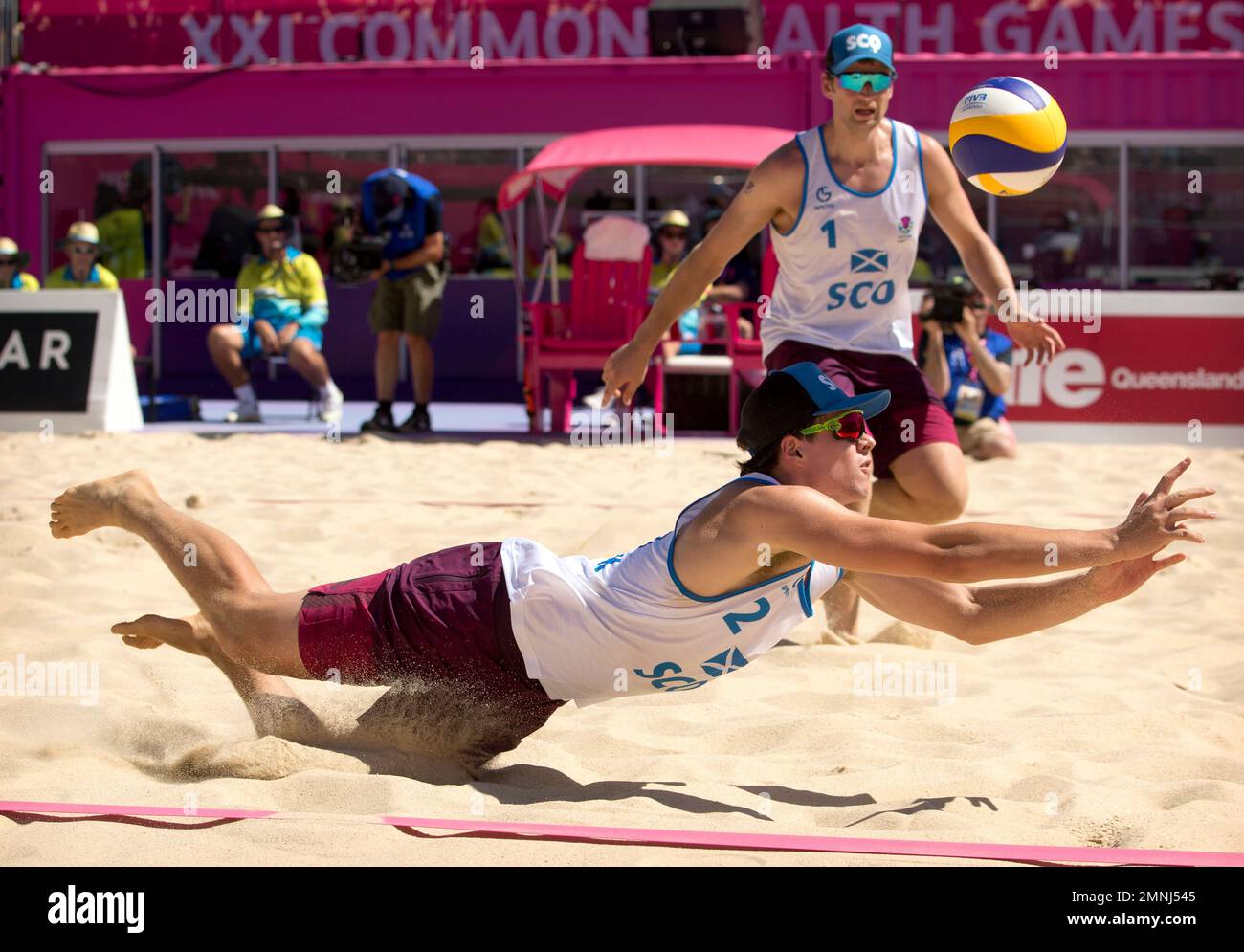 Scotland's Seain Cook dives for the ball ahead of teammate Robin ...