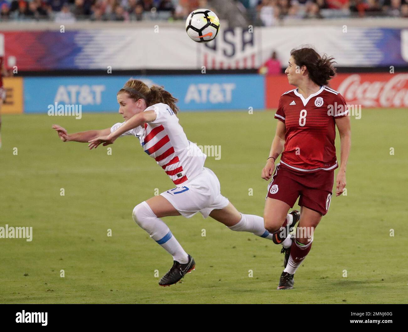 United States' Tierna Davidson, left, loses her footing as she goes ...
