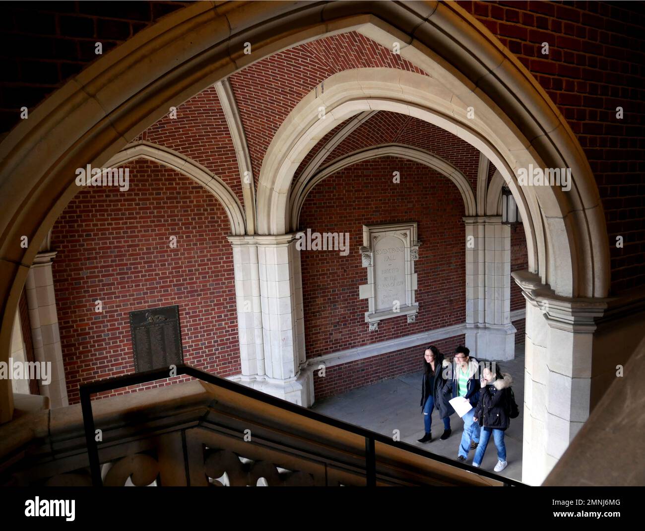 People walk through one of the famous arches of Princeton University in ...