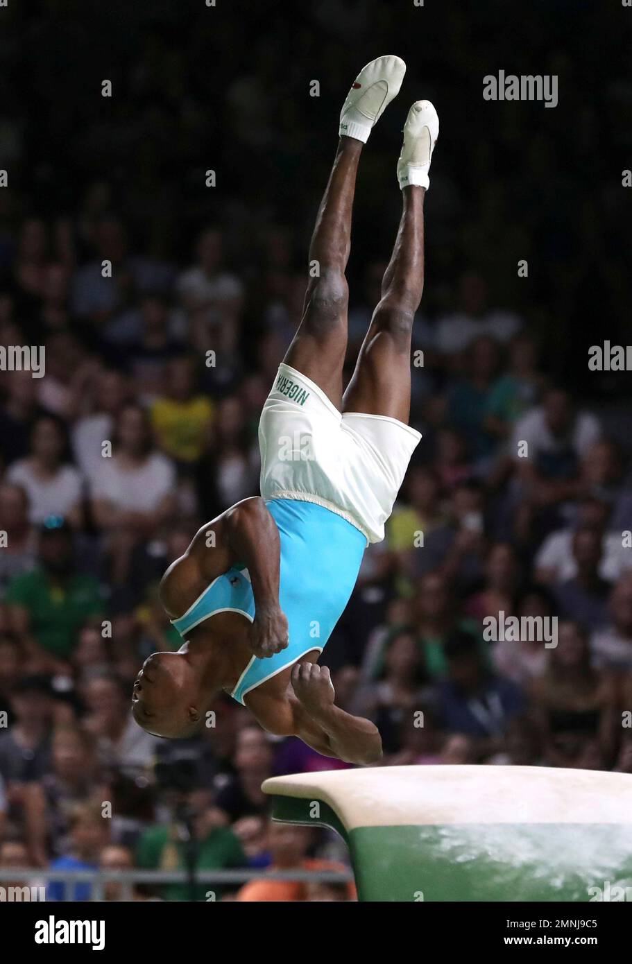 Nigeria's Tayo Fakiesi competes on the vault at the men's artistic ...