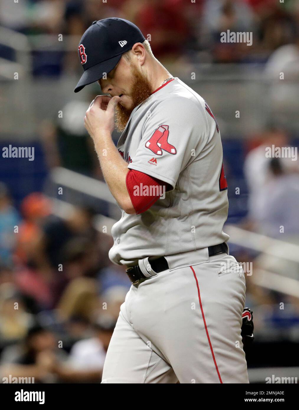 Boston Red Sox relief pitcher Craig Kimbrel walks off after pitching in ...