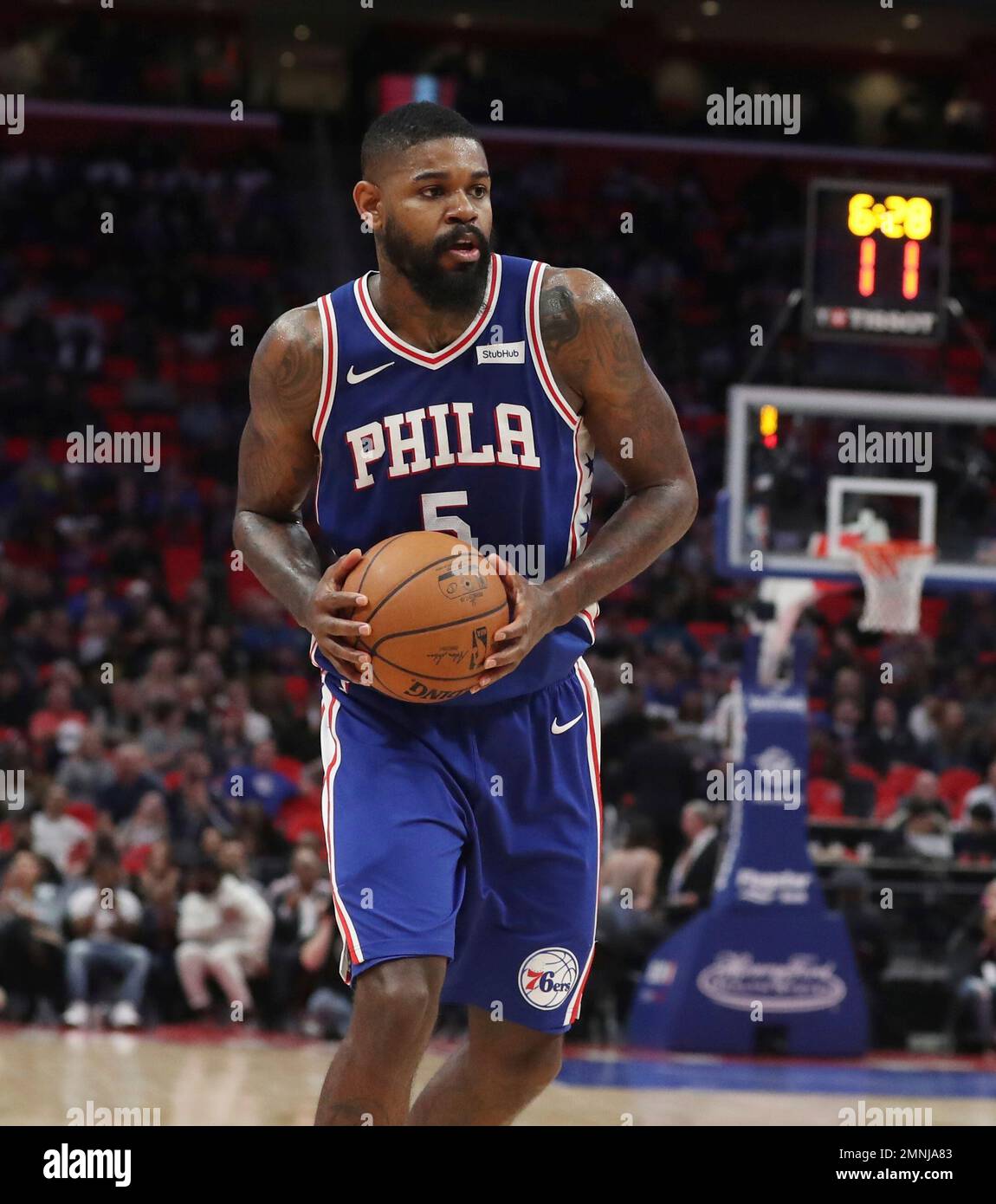Philadelphia 76ers center Amir Johnson brings the ball up court during ...