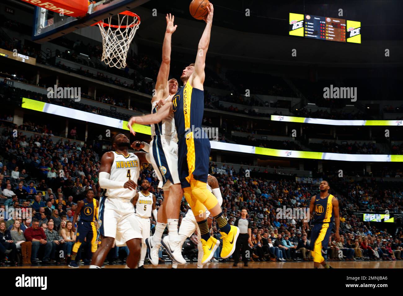 Denver Nuggets center Mason Plumlee (24) and Indiana Pacers center ...