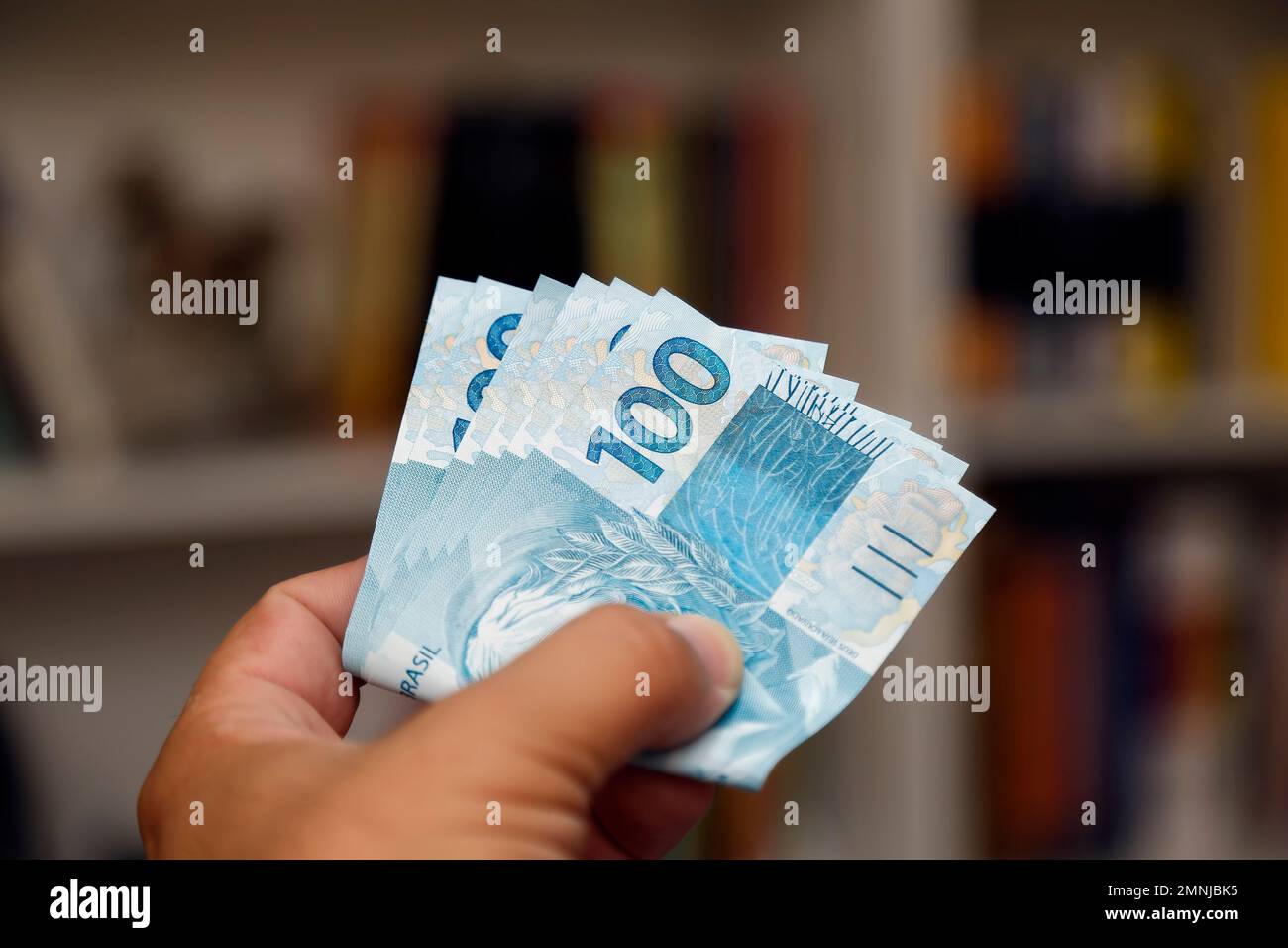 Hand counting money stack one hi-res stock photography and images - Alamy