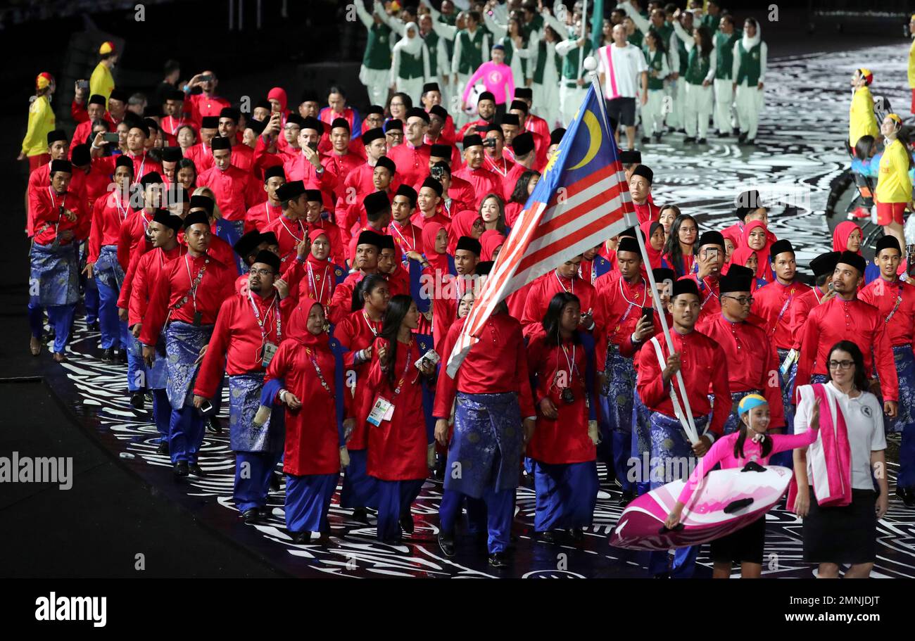 Team Malaysia is lead by flagbearer Muhammad Hakimi Ismail at Carrara ...