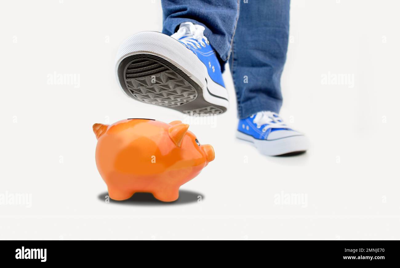 A shoe treads piggy bank as a metaphor about savings problems Stock ...