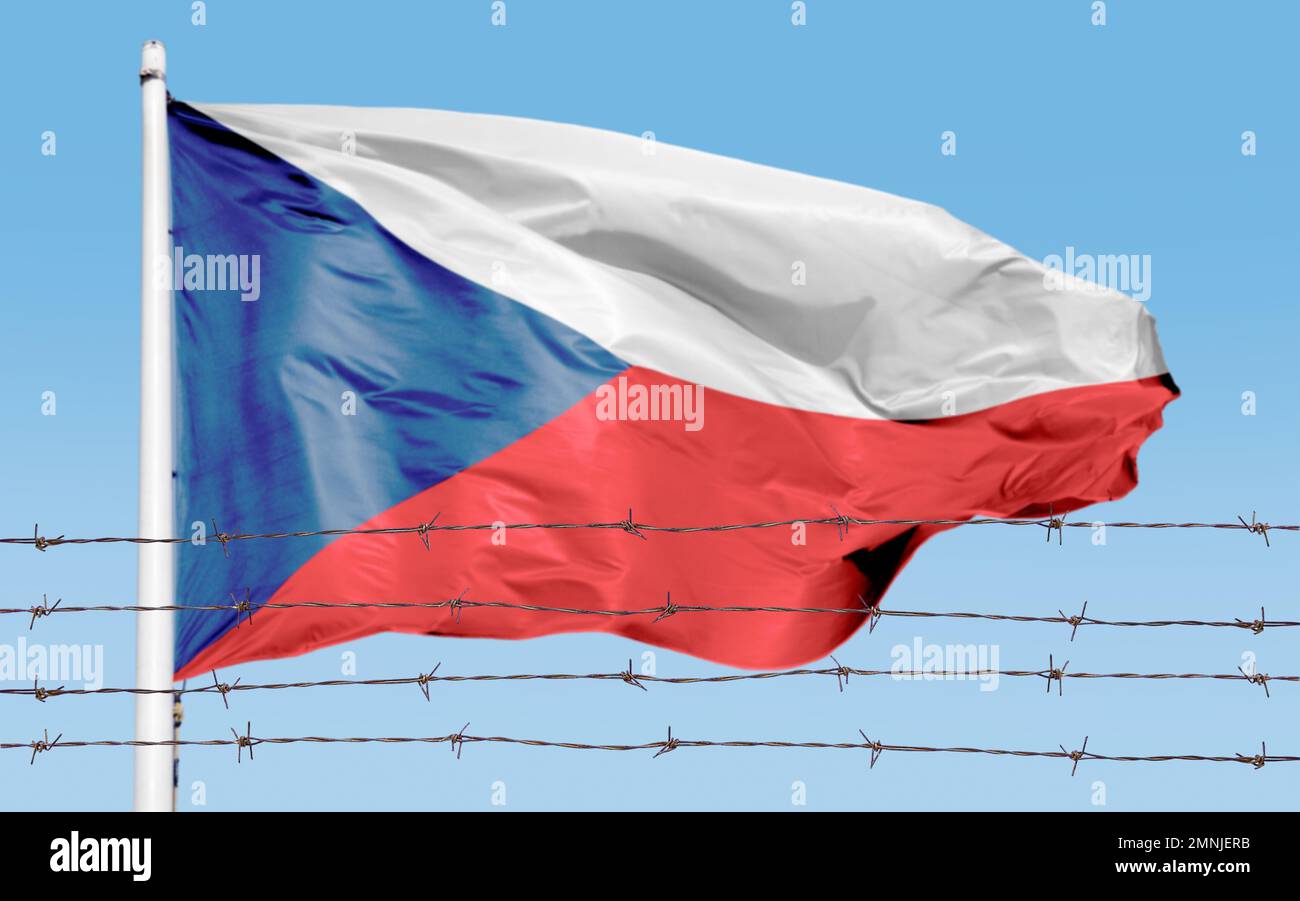 Metal fence with barbed wire on a Czech flag. Separation concept ...