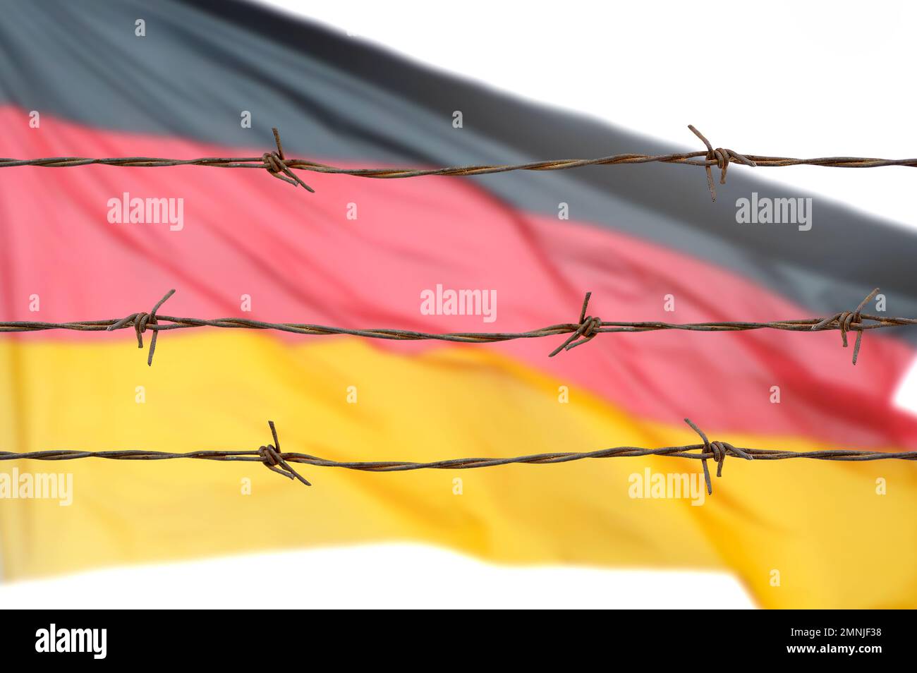 Metal fence with barbed wire on a Germany flag. Separation concept ...