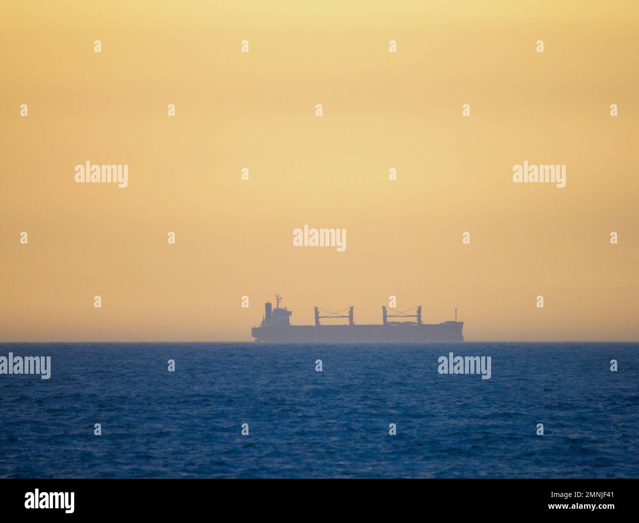 Container ship cruising on calm sea Stock Photo - Alamy