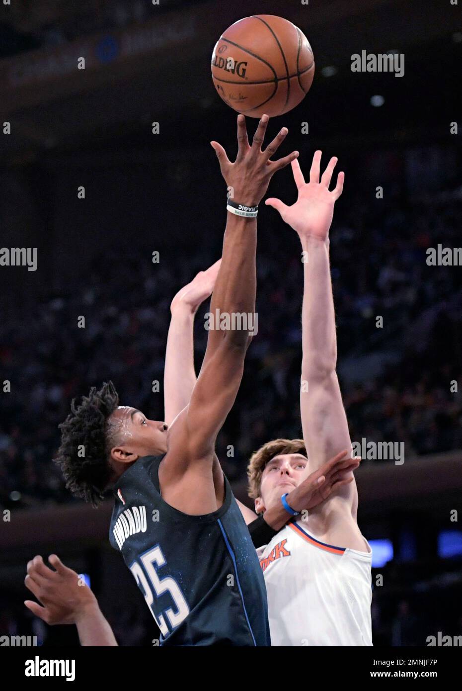 Orlando Magic forward Wesley Iwundu (25) puts up a shot over New York ...