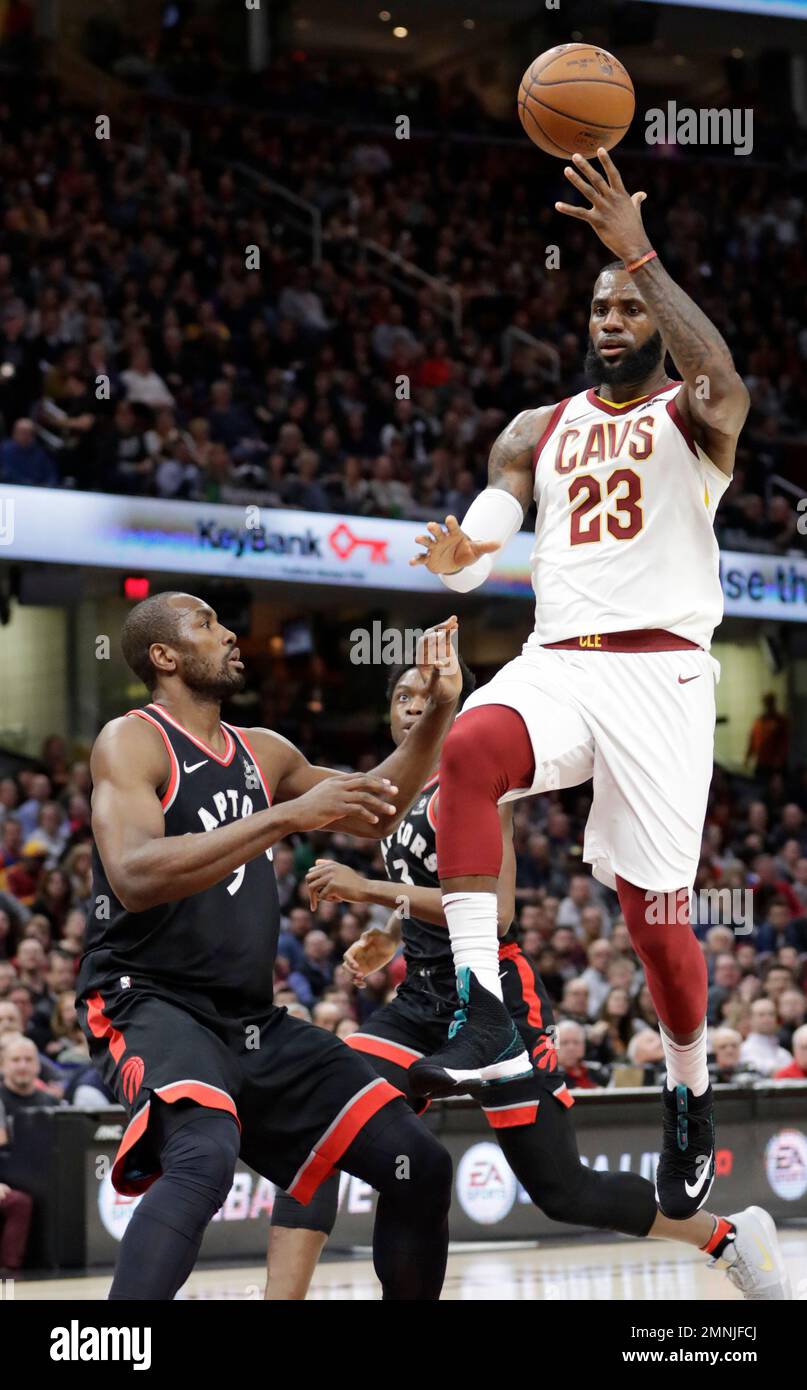 Cleveland Cavaliers' LeBron James (23) passes the ball over Toronto ...