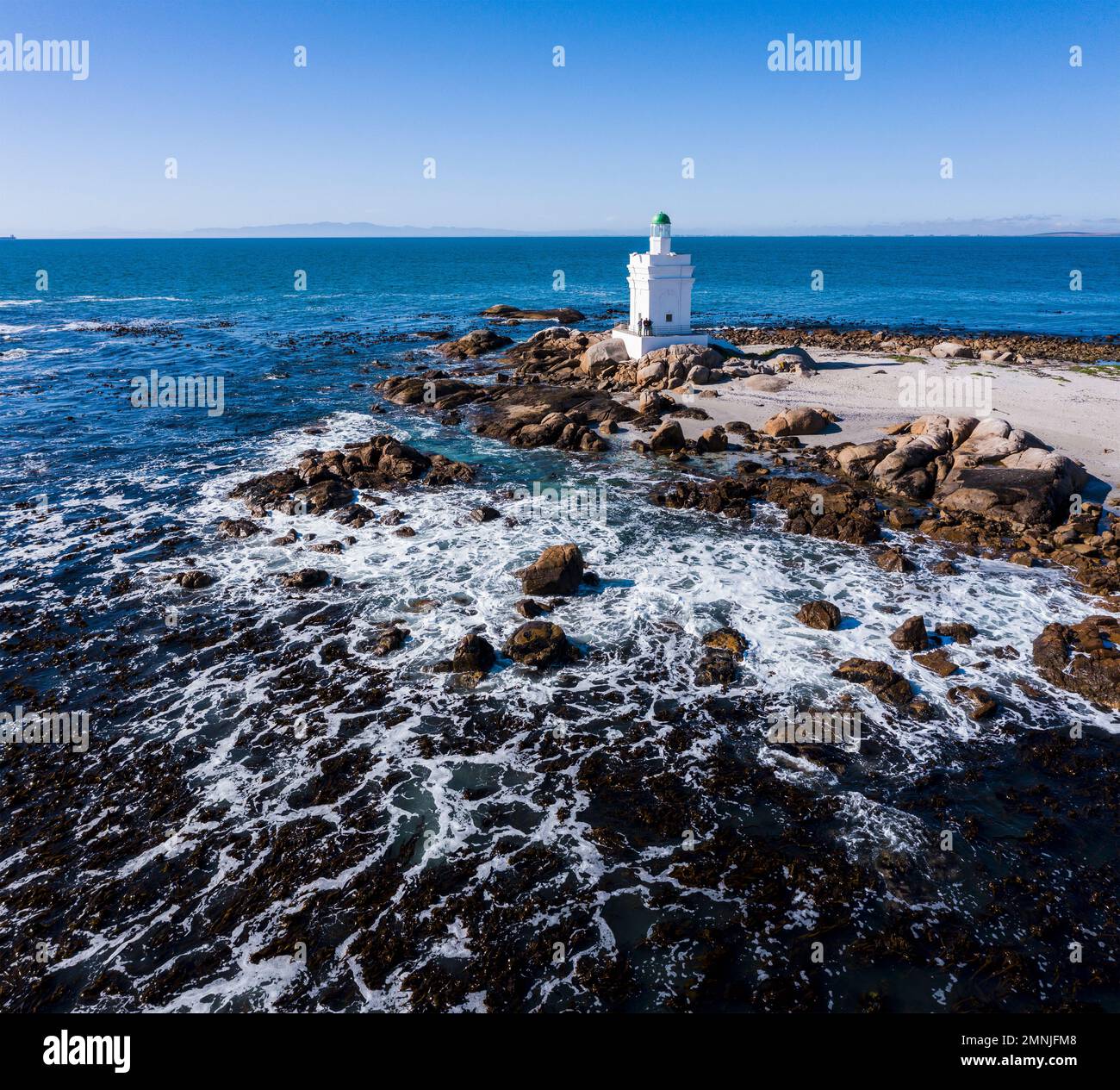 South Africa, Western Cape, St. Helena Bay, White lighthouse on coast ...