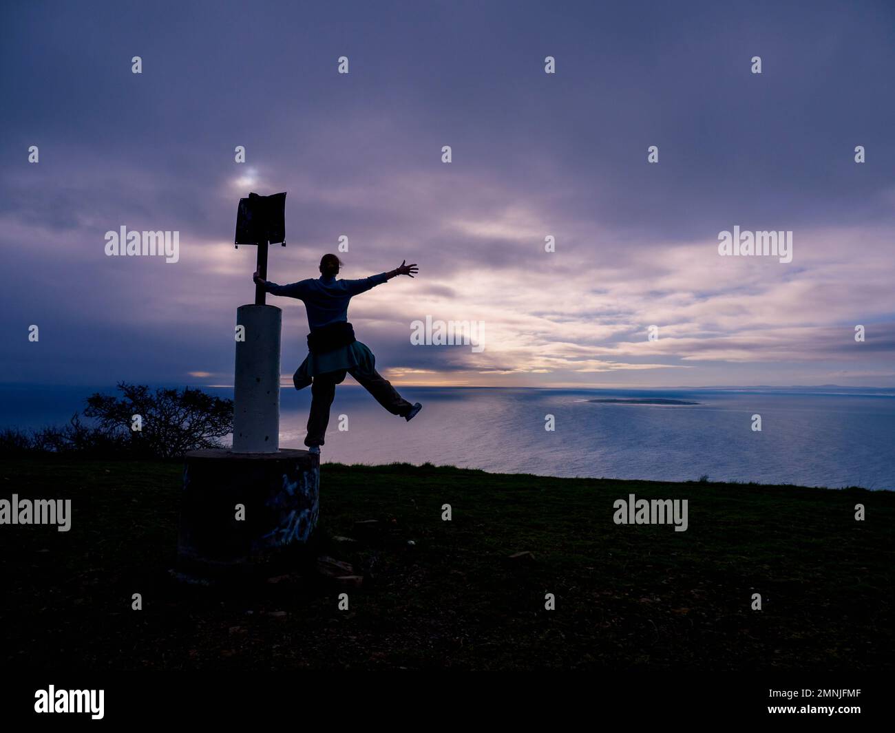 Woman standing sea raised arms hi-res stock photography and images - Alamy