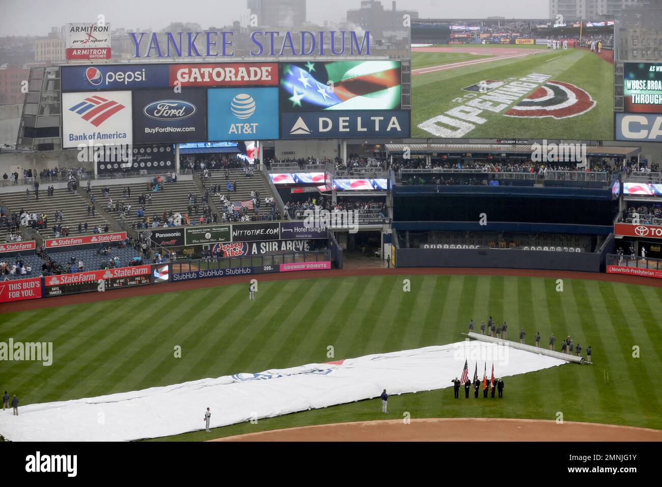 People stand for the National Anthem before the New York Yankees' home ...