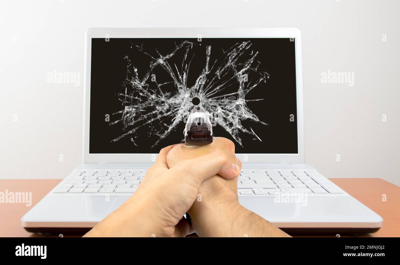 Crime internet laptop pistol hi-res stock photography and images - Alamy