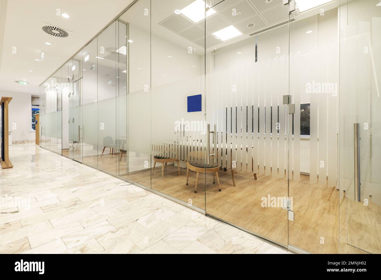Offices with glass walls and doors in an office Stock Photo - Alamy