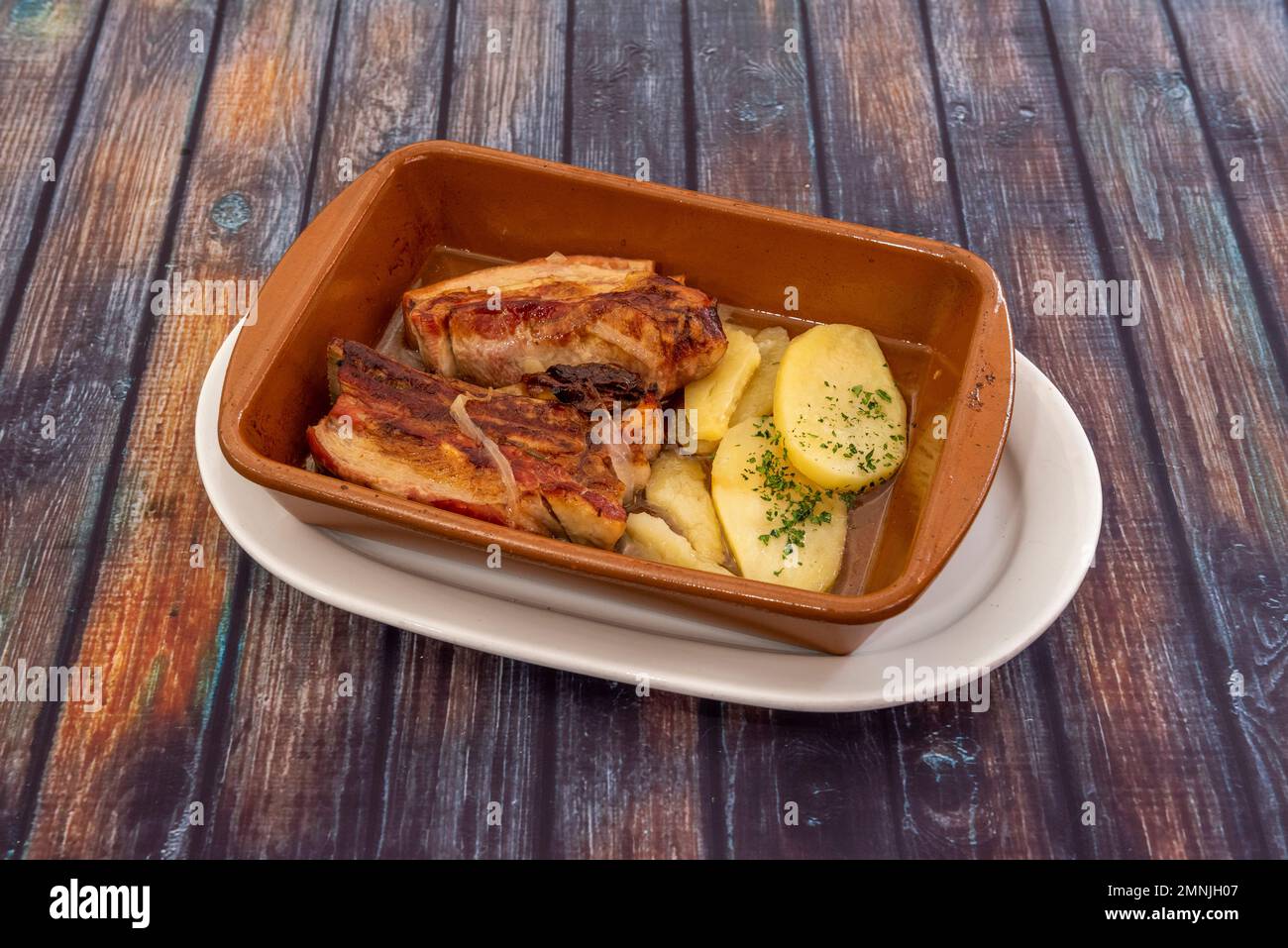 Roast beef brisket with baked potatoes in a clay pot Stock Photo - Alamy