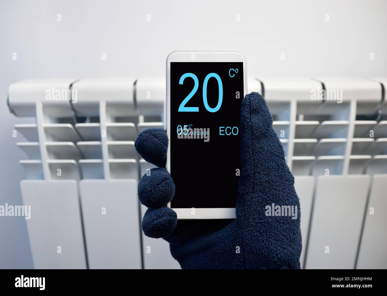close up of a person hand adjusting temperature on thermostat through ...