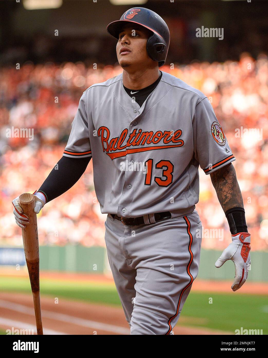 Baltimore Orioles' Manny Machado walks to the dugout after striking out ...