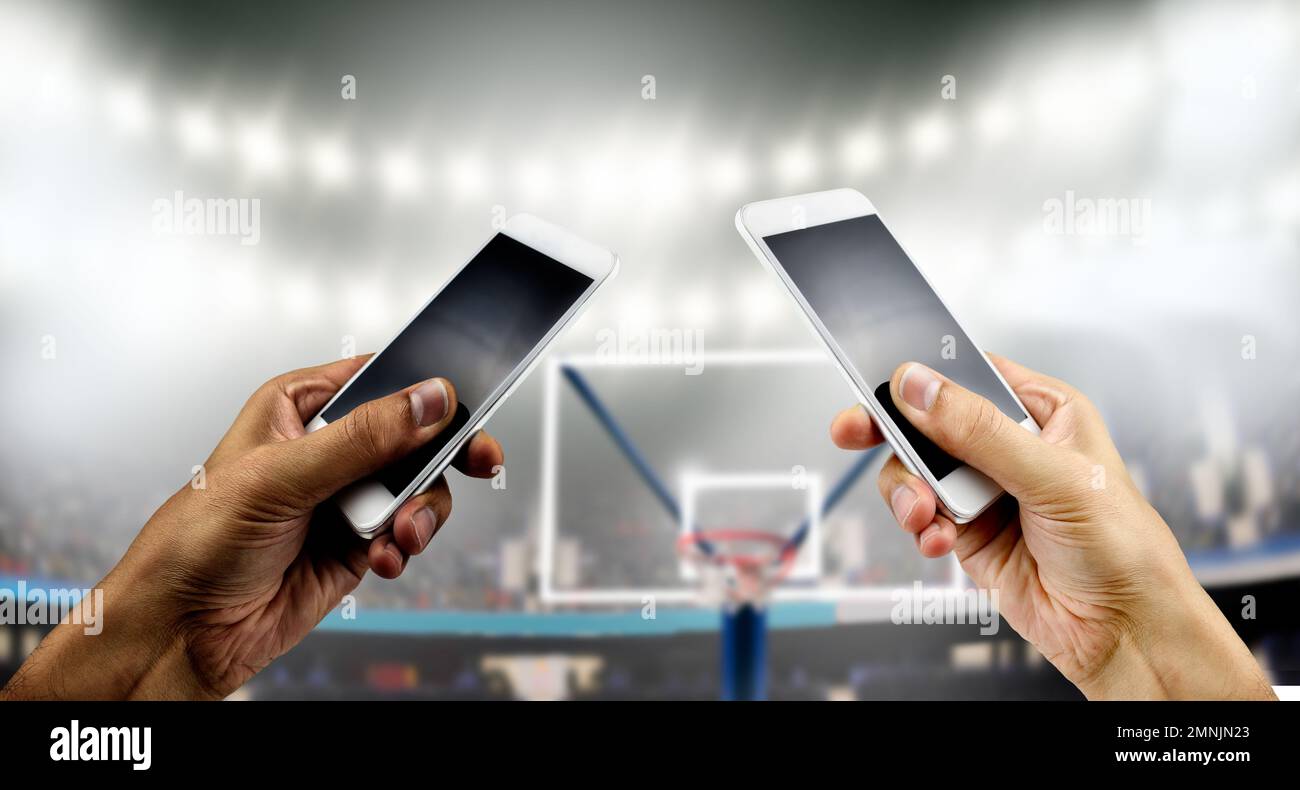 friends using the phone to bet on the arena Stock Photo - Alamy