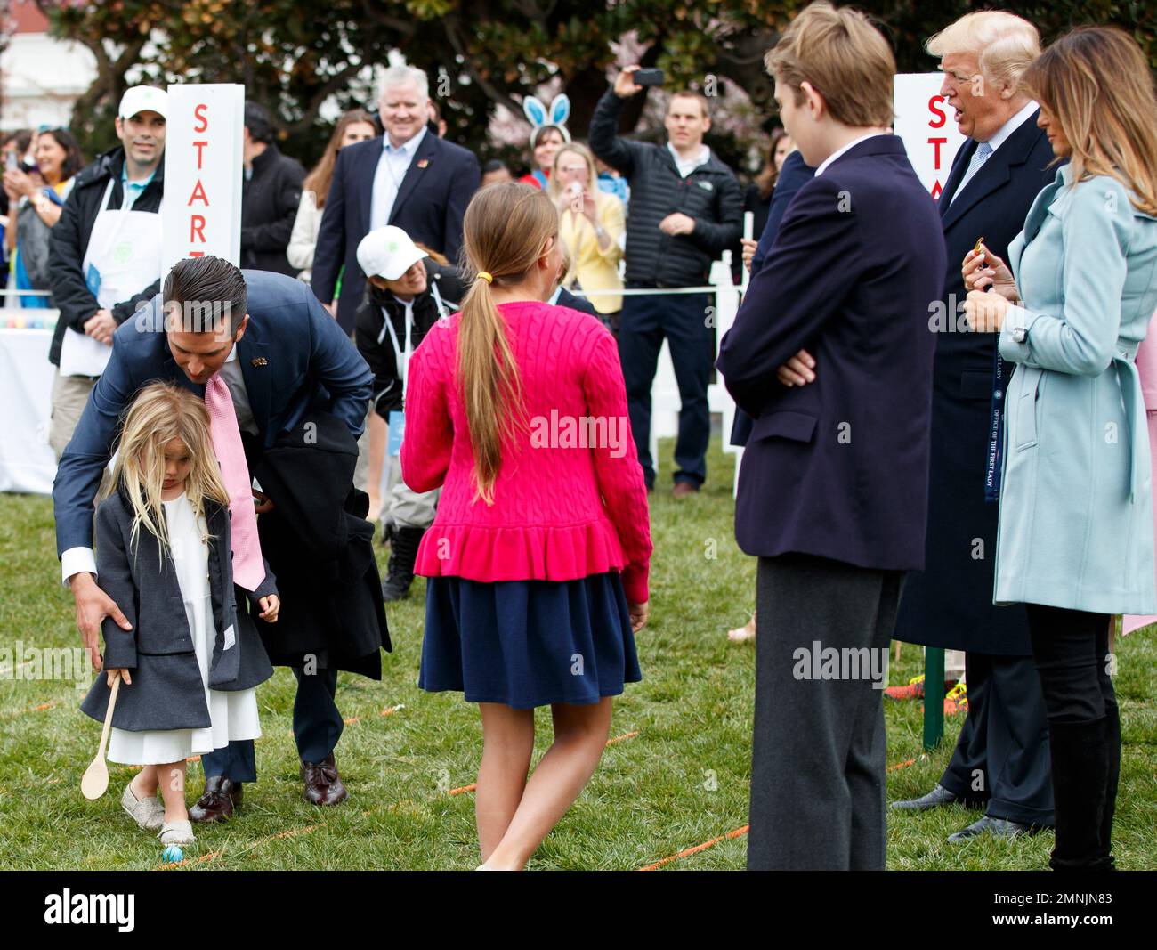 From left, Chloe Trump is helped by her father Donald Trump Jr., as Kai ...