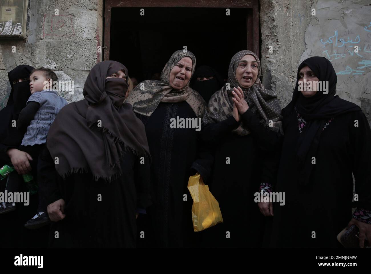 Palestinian relatives of 29-year-old Fares al-Reqeb, who died Monday of ...