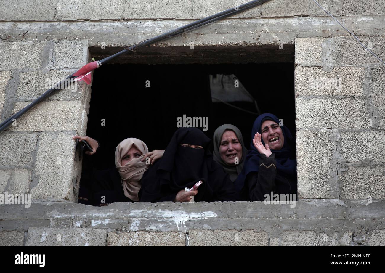 Palestinian relatives of 29-year-old Fares al-Reqeb, who died Monday of ...