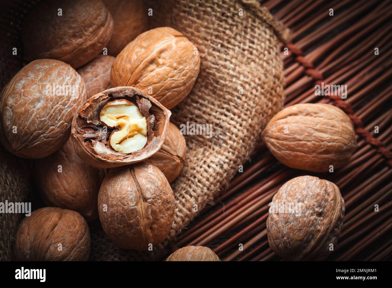 handful of nuts on a sheet of jute with broken shell Stock Photo - Alamy