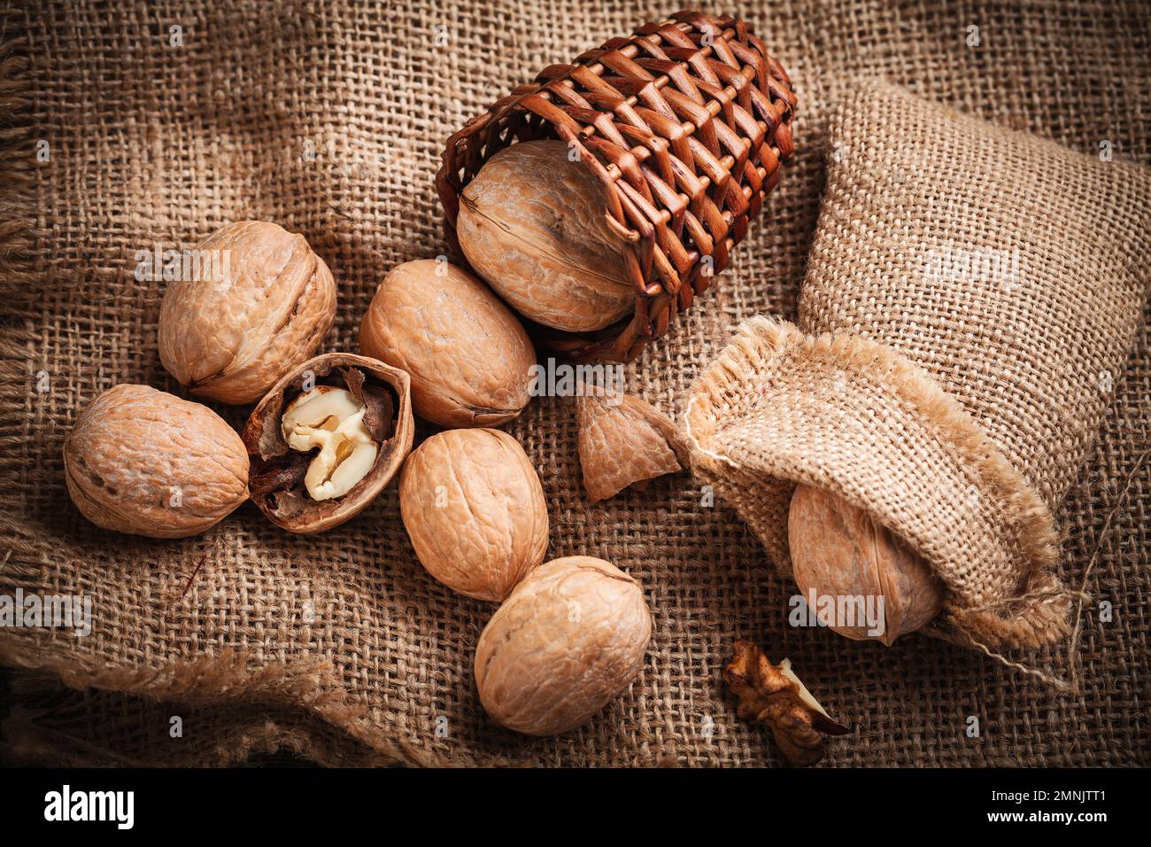 handful of nuts on a sheet of jute with broken shell Stock Photo - Alamy