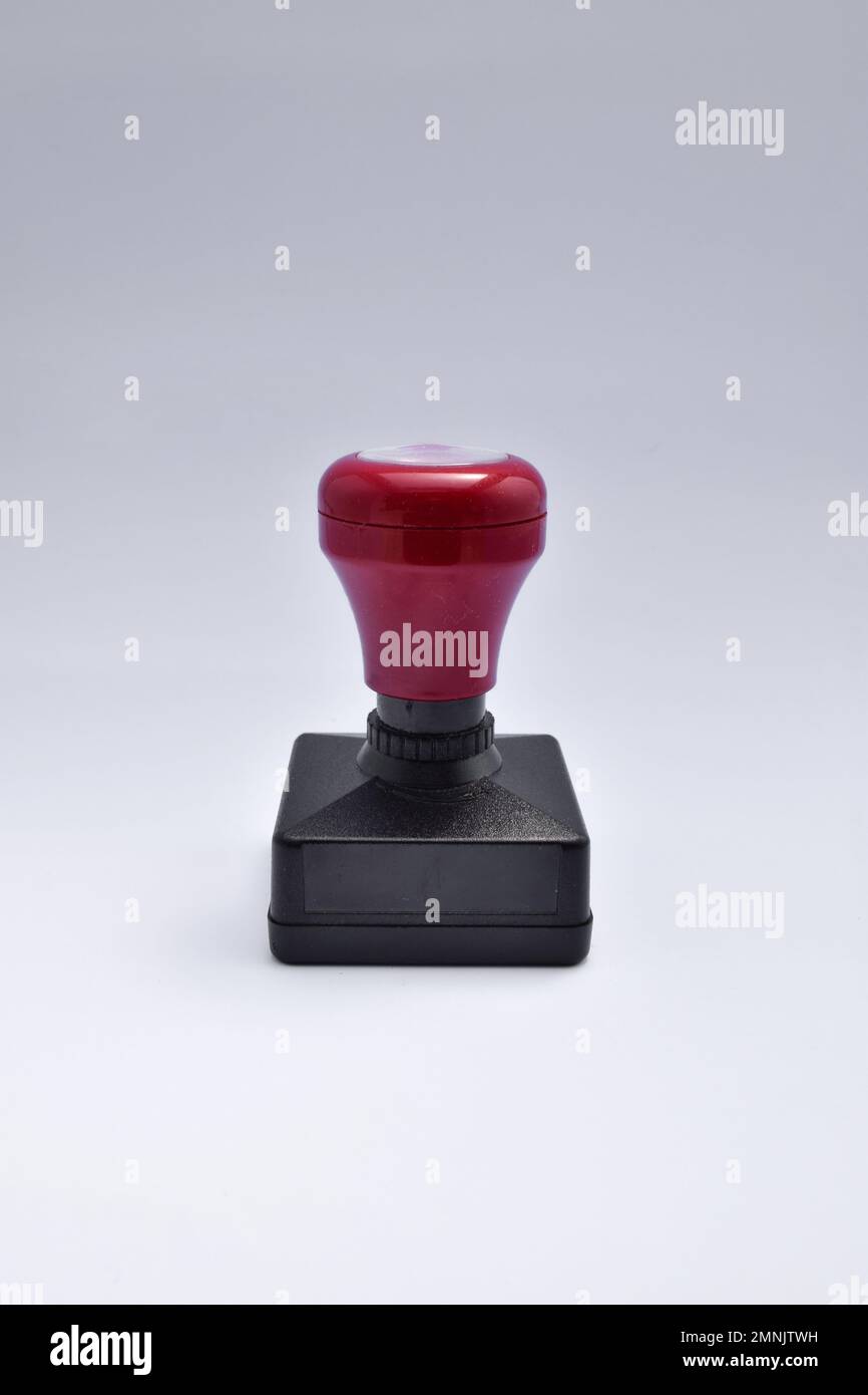 Plastic Red Rubber Stamper Isolated on White Background Stock Photo - Alamy