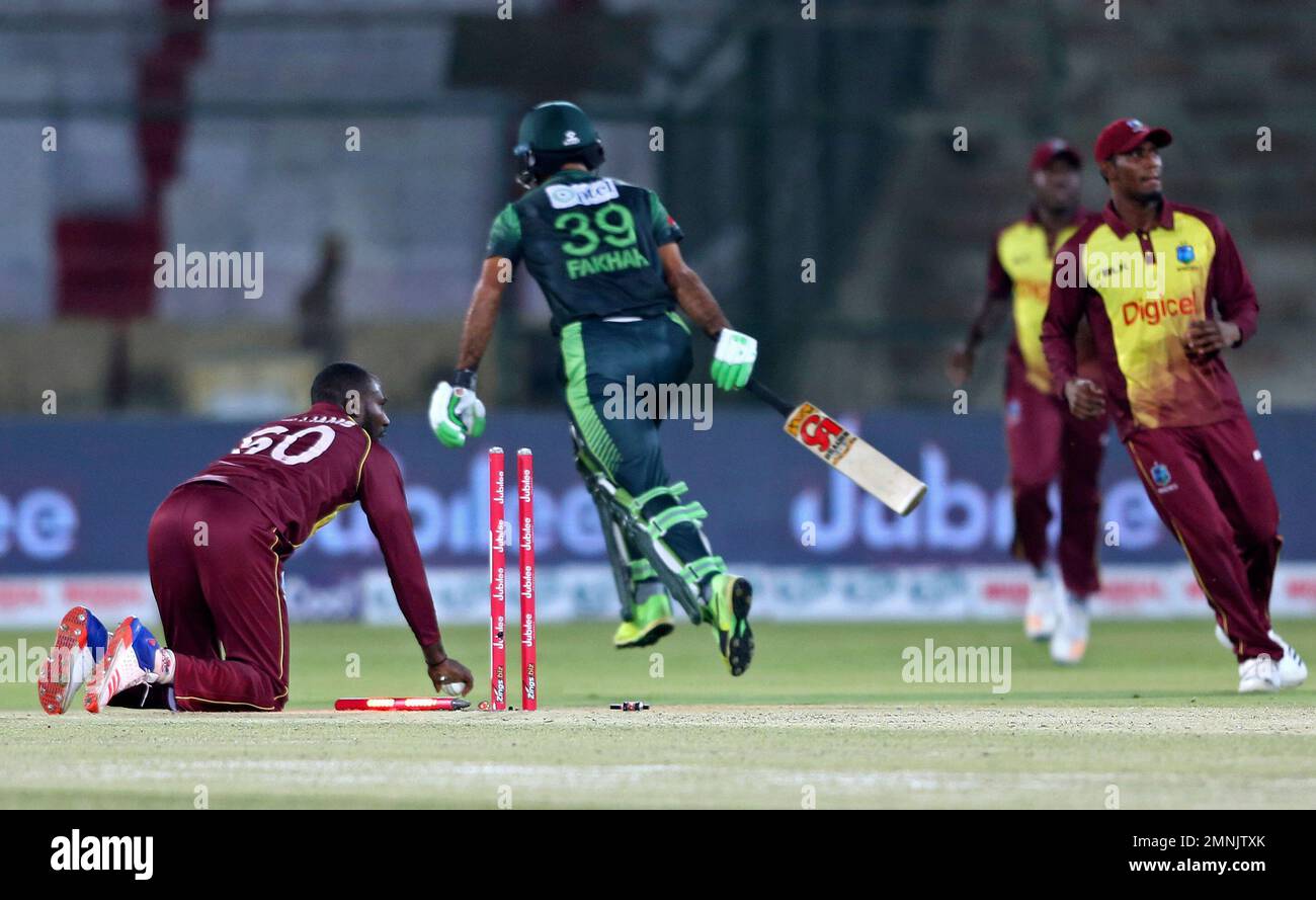 West Indies player Kestrick Williams, left, looks to the umpire after ...