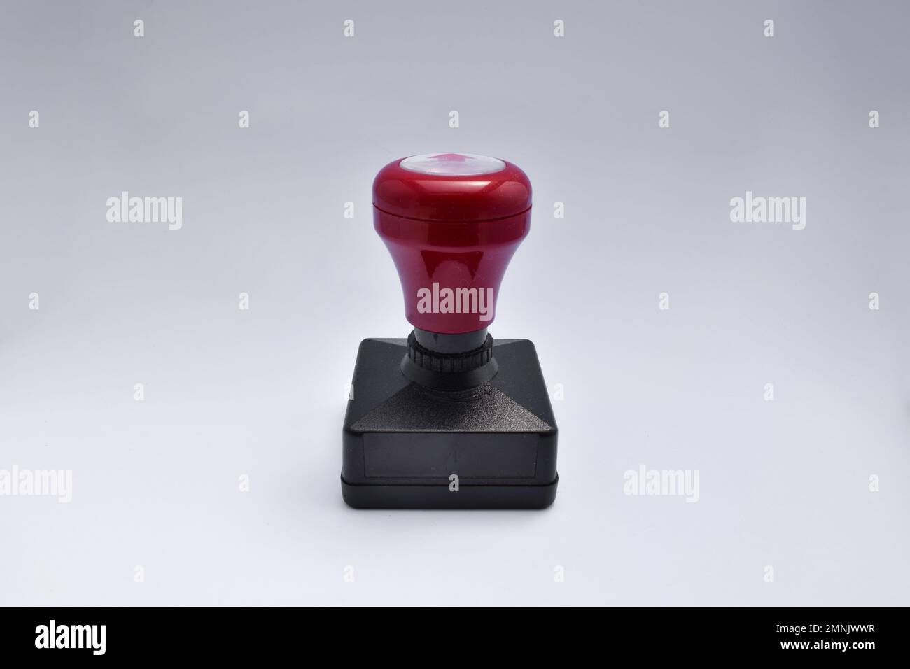 Plastic Red Rubber Stamper Isolated on White Background Stock Photo - Alamy
