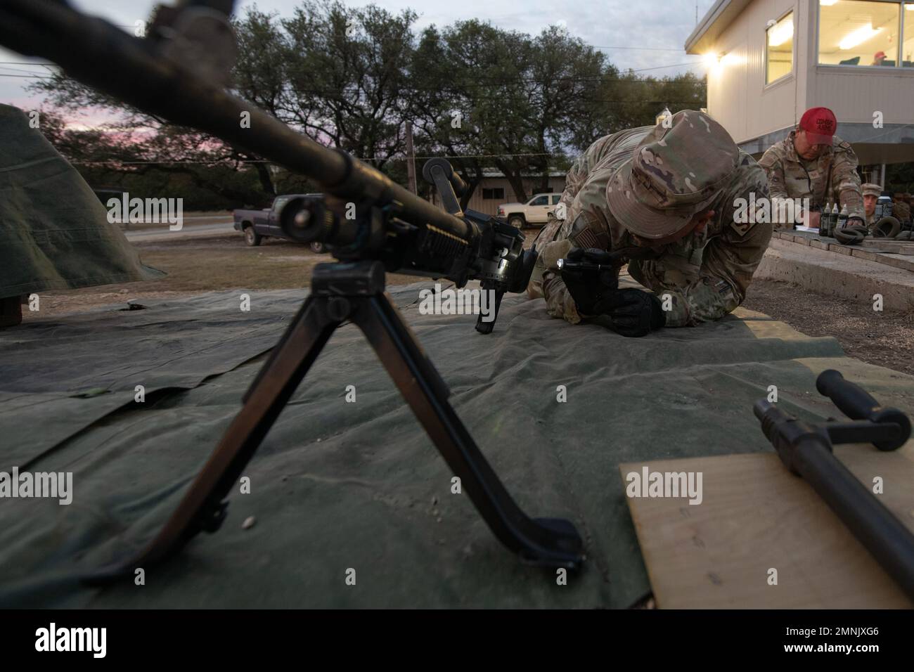U.S. Air Force Airmen First Class Charles McGuire, student, left, reads the serial number on an ...