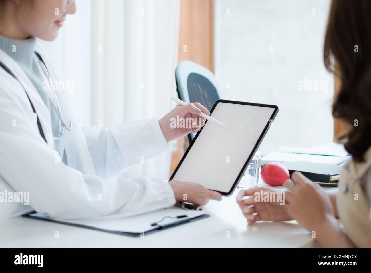 Doctor discussing and explain to patient about life plan. Medicine and ...