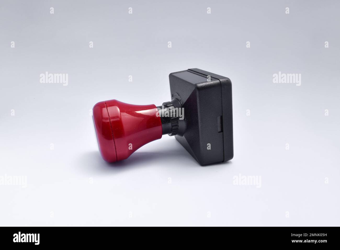 Plastic Red Rubber Stamper Isolated on White Background Stock Photo - Alamy