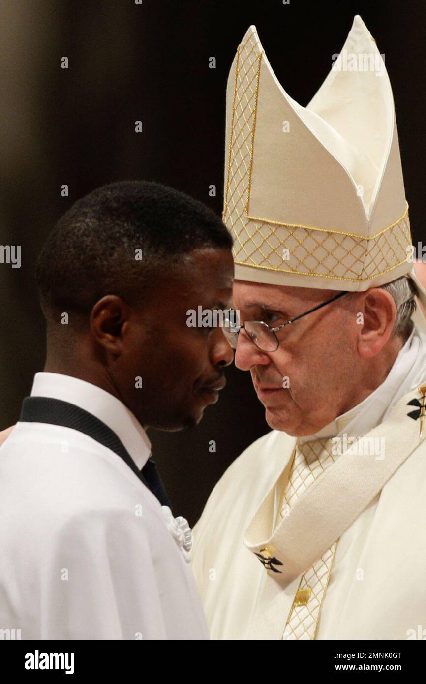 John Ogah walks past Pope Francis after being baptized during a solemn ...