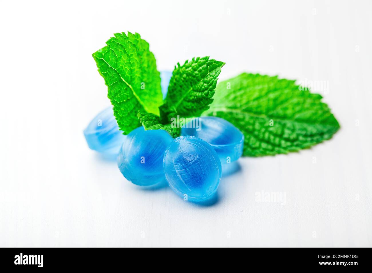 Blue menthol fresh balsamic syrup with mint leaves on a white ...