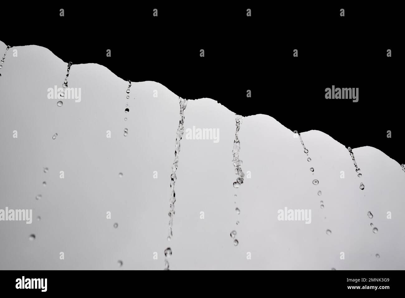 Close-up drops of rain fall from the roof, in the rainy season Stock ...
