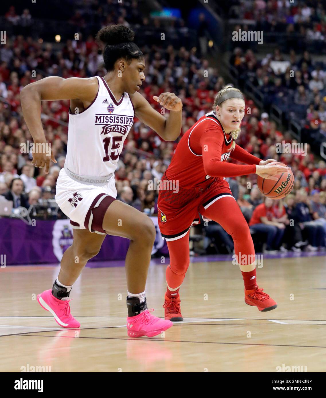 Louisville's Sam Fuehring, right, dribbles around Mississippi State's ...