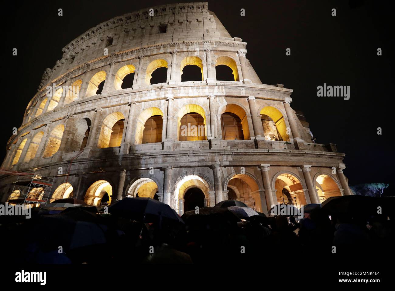 People stand in front of Rome's Colosseum as they wait for the arrival ...
