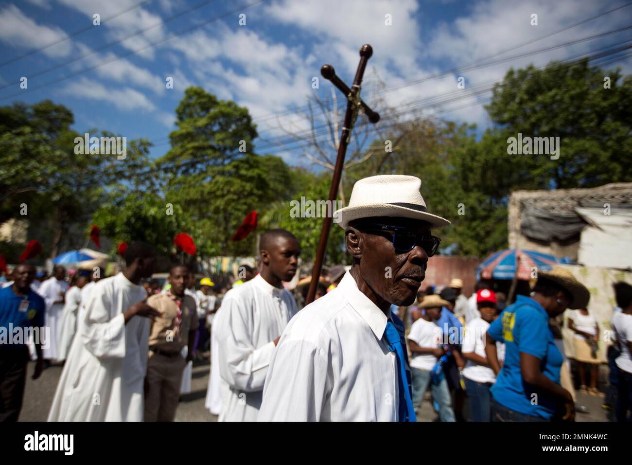 Haitians walk to the fifth station in the Way of the Cross procession ...
