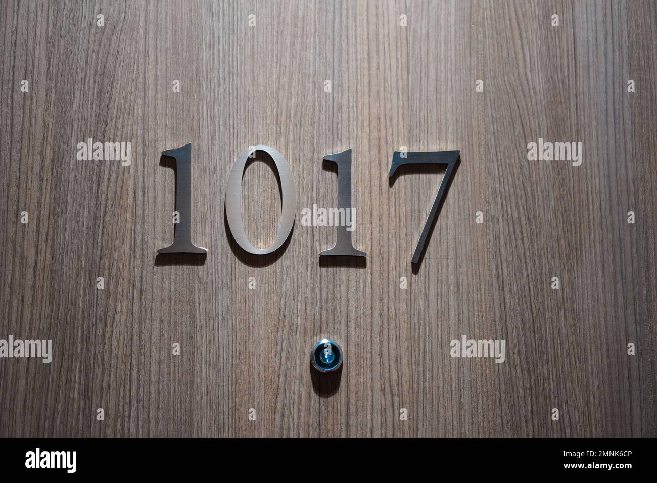 Numbers 1017 on door, close up image Stock Photo - Alamy