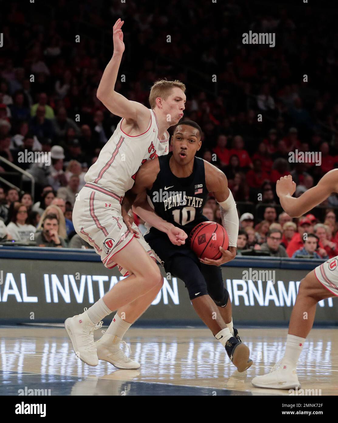 Penn State guard Tony Carr (10) drives against Utah forward Tyler ...
