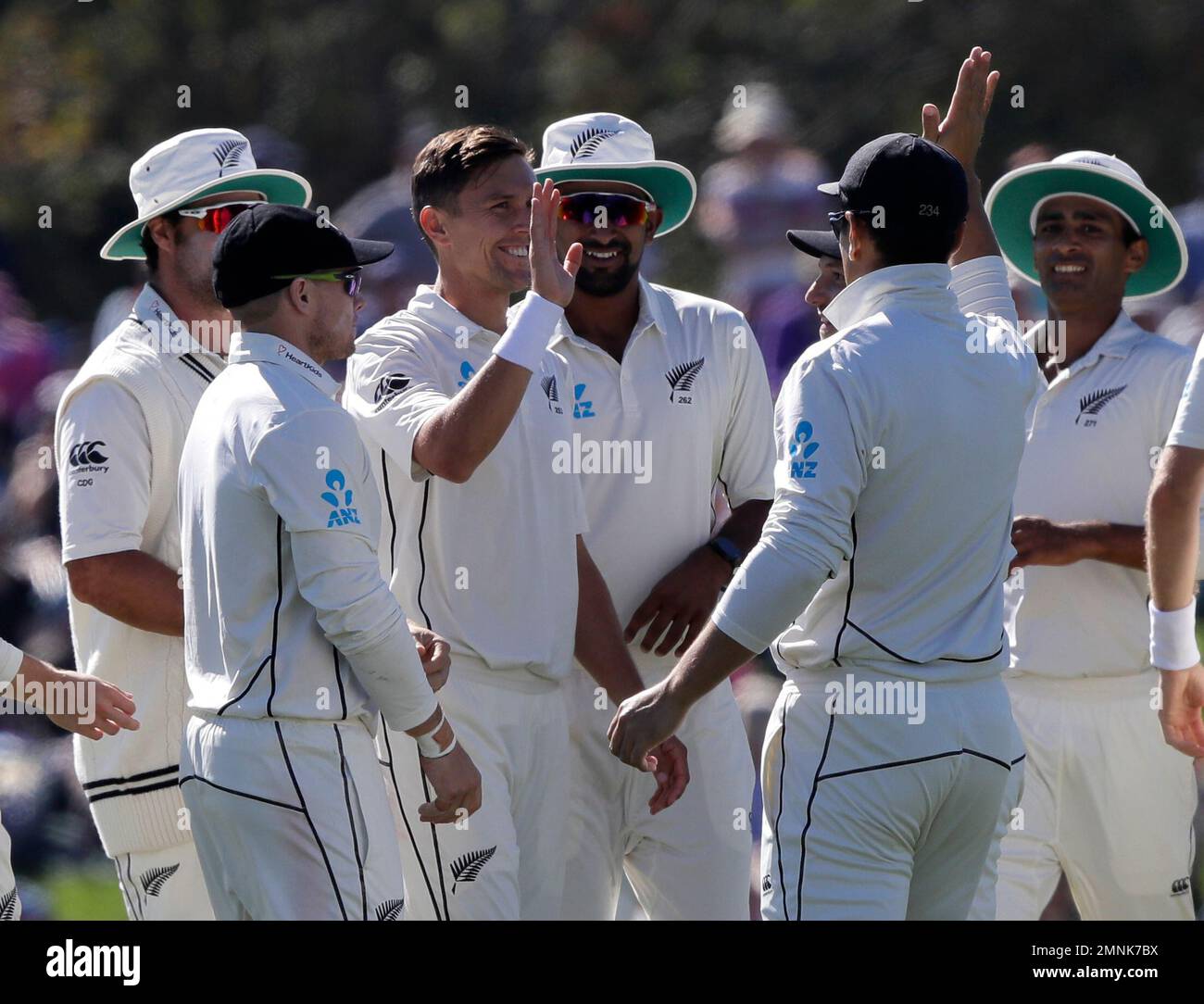 New Zealand's Trent Boult, centre, is congratulated by teammates after ...