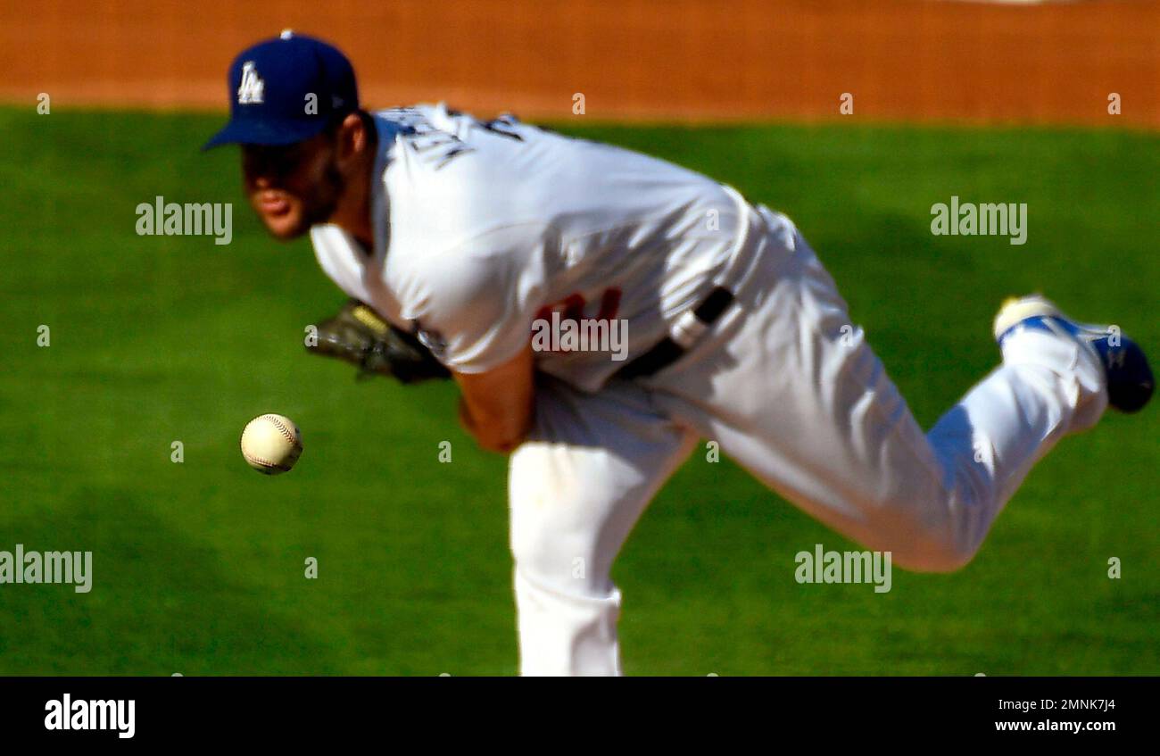 Los Angeles Dodgers starter Clayton Kershaw throws the first pitch of ...