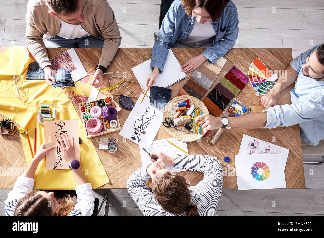 Fashion designer creating new clothes in studio, top view Stock Photo ...