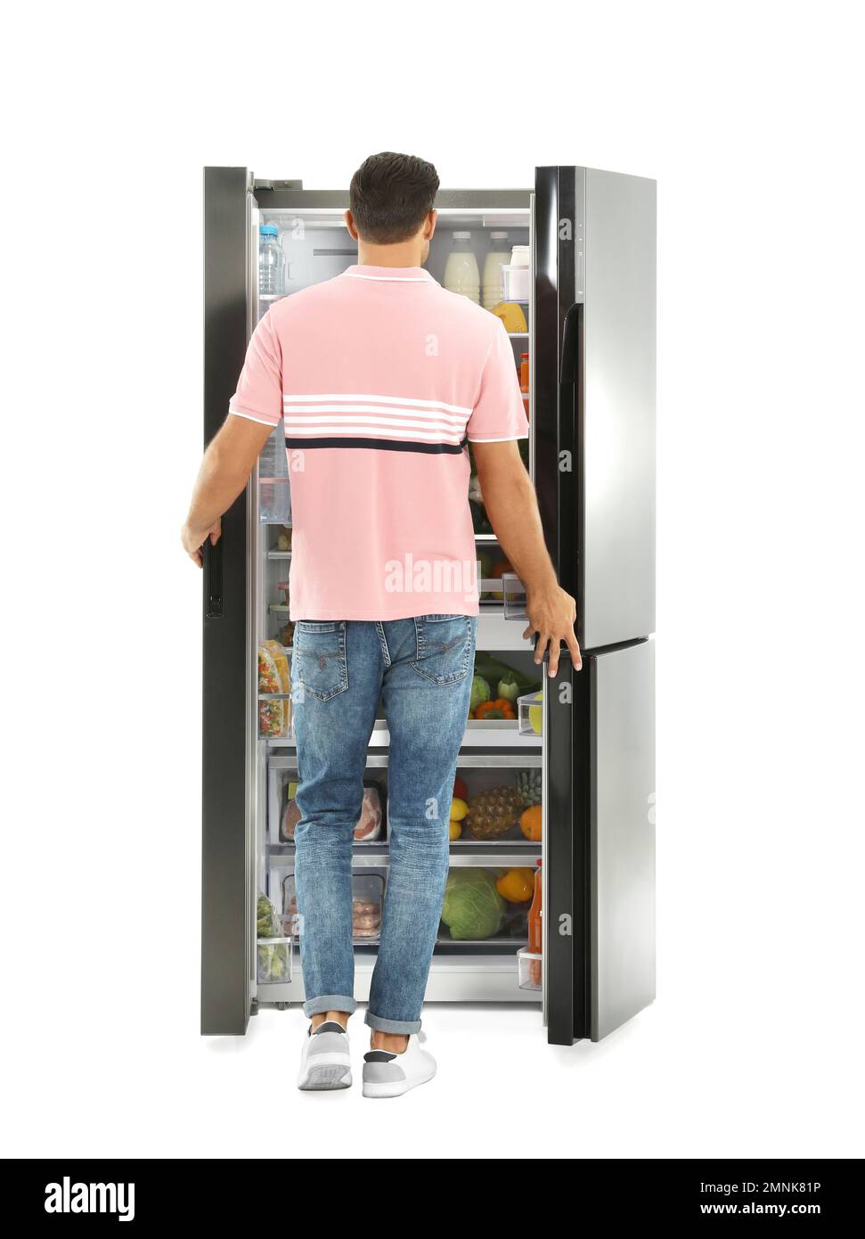 Man near open refrigerator on white background, back view Stock Photo ...