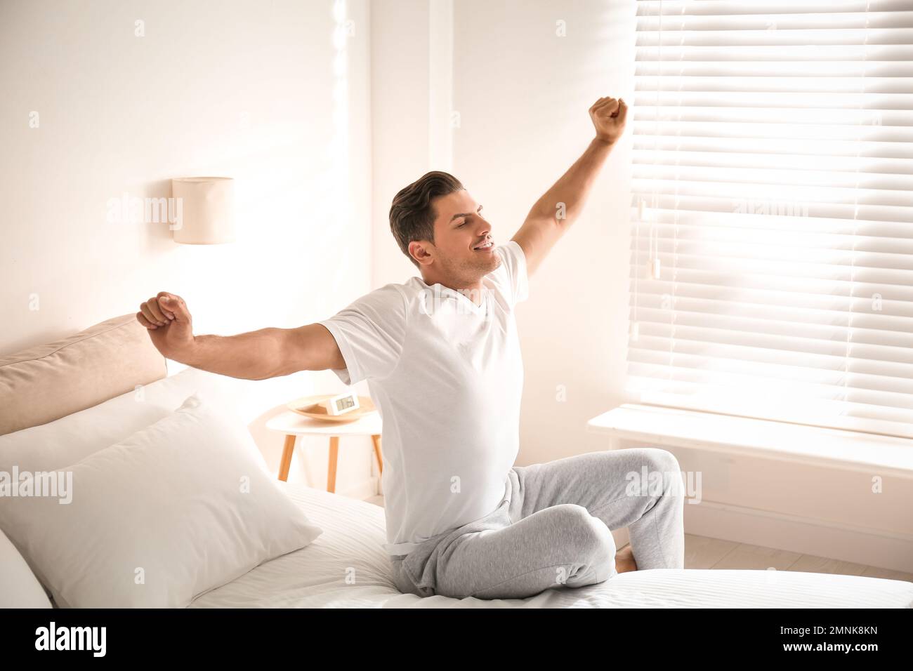 Man awakening on bed hi-res stock photography and images - Alamy